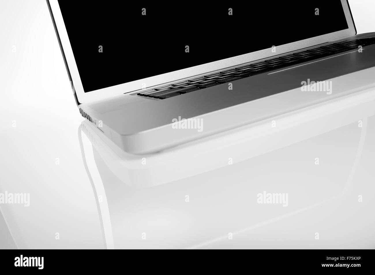 Modern silver laptop on white background Stock Photo - Alamy