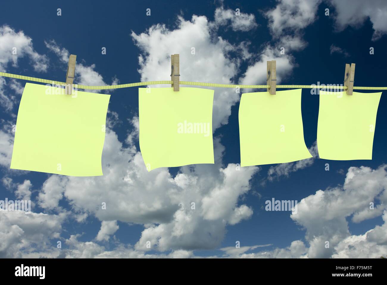 Four clean memo hanging on a cord. 3D image Stock Photo - Alamy