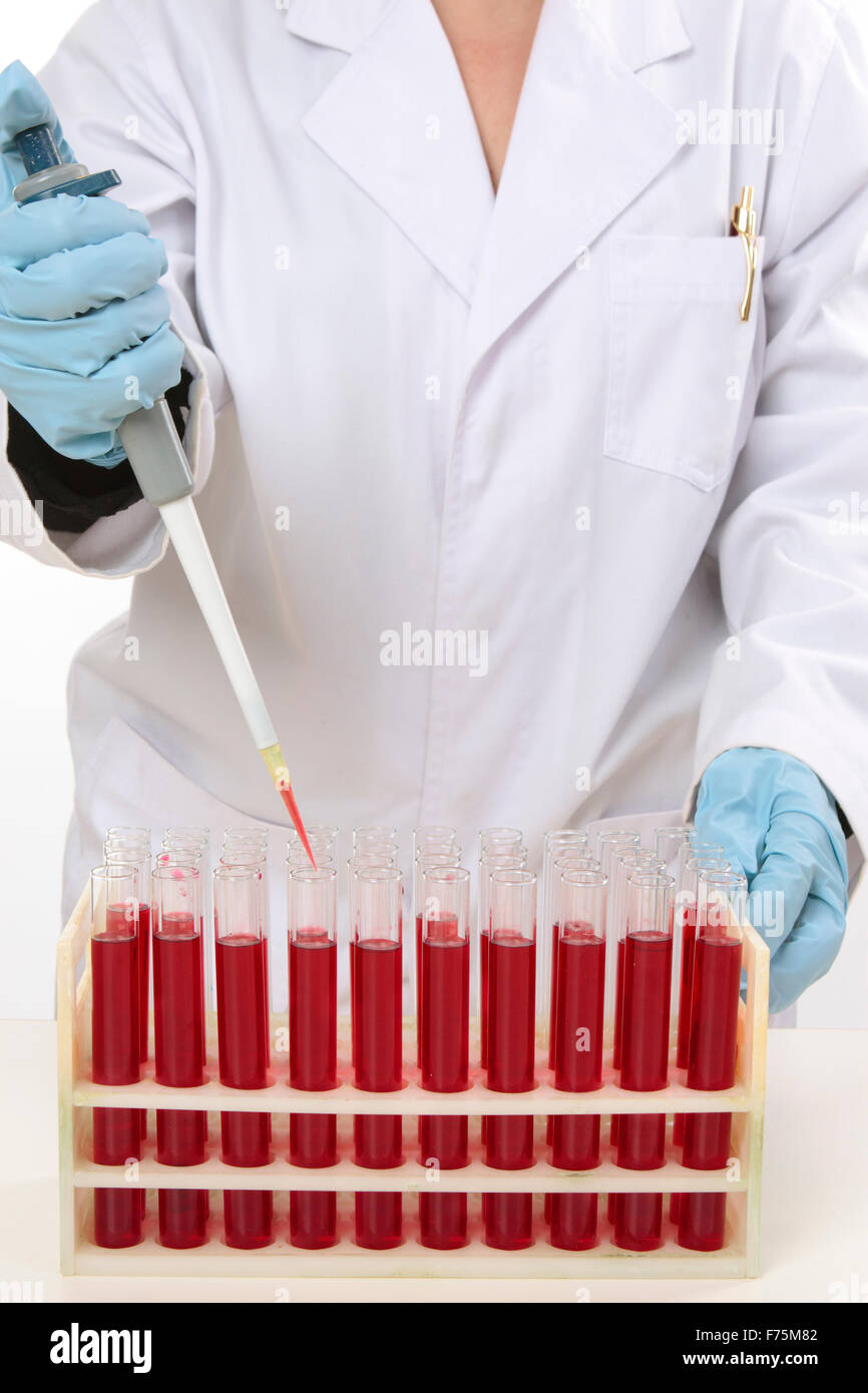 Scientist using pipette to extract samples Stock Photo - Alamy