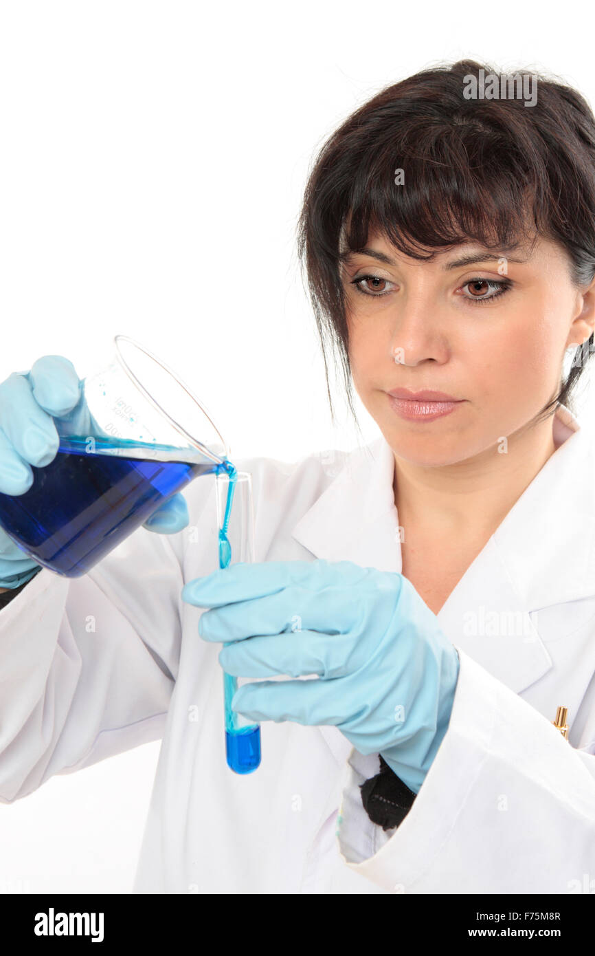 Chemist pours liquid into test tube Stock Photo - Alamy