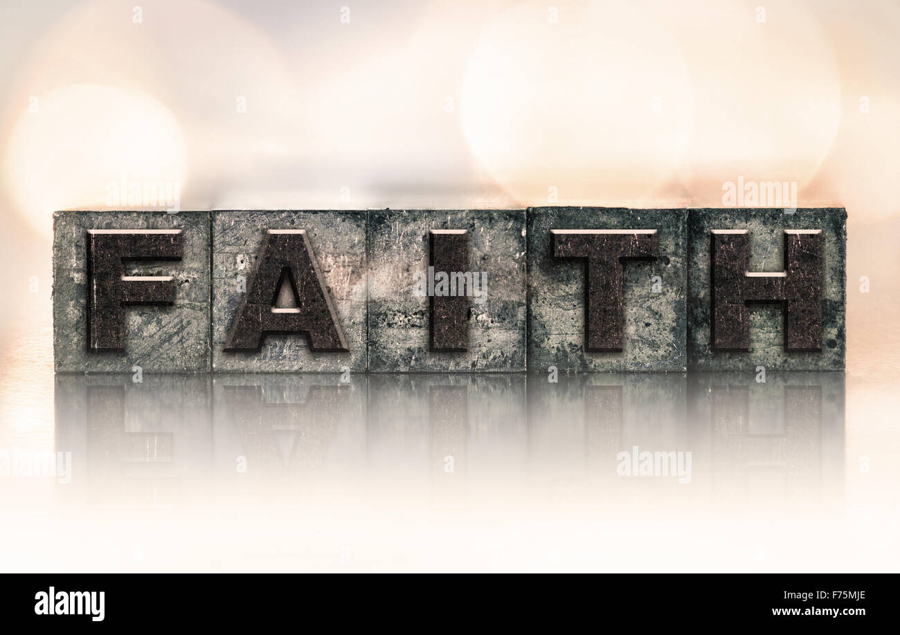 The word "FAITH" written in vintage ink stained letterpress type Stock ...