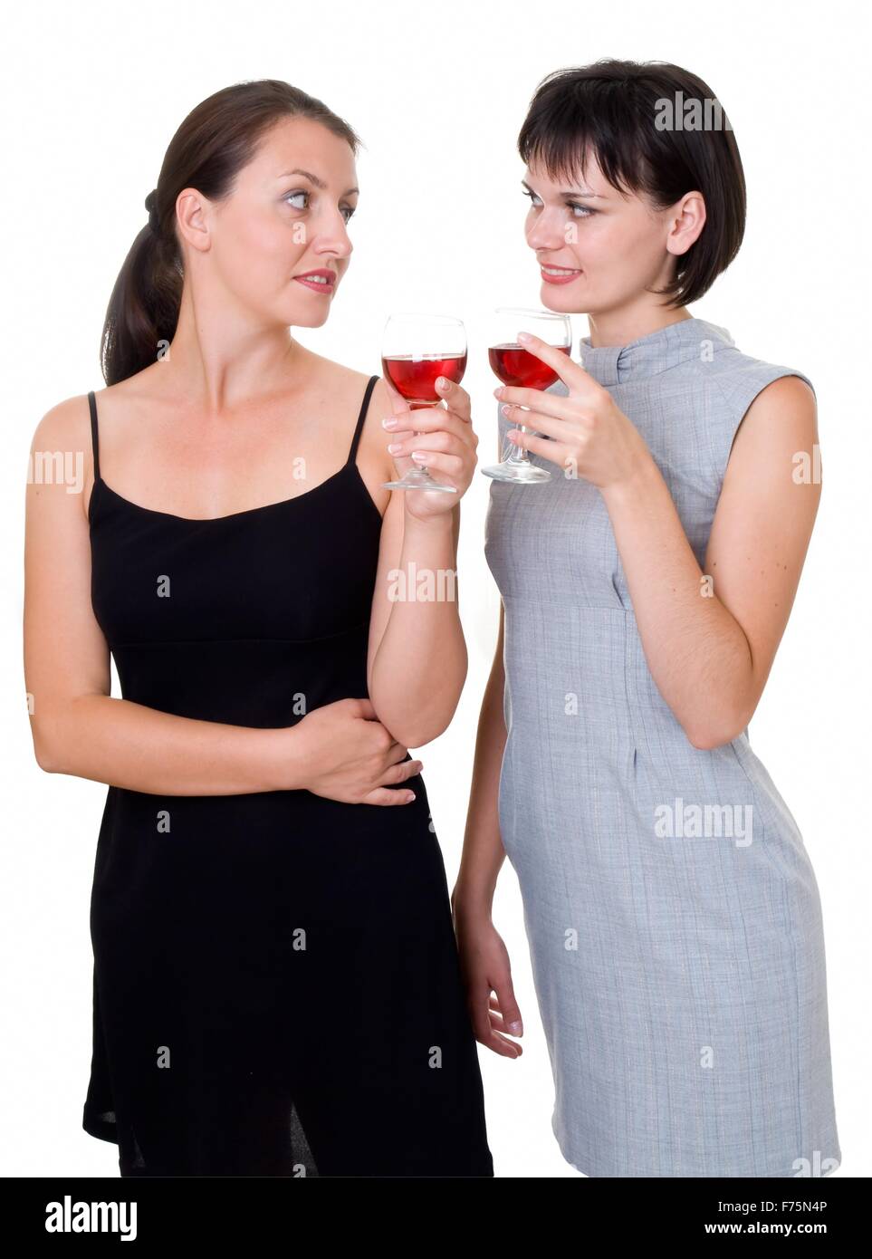 Two beautiful girls with wine Stock Photo - Alamy