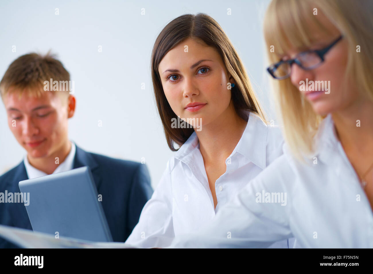 Working woman with her colleagues Stock Photo - Alamy