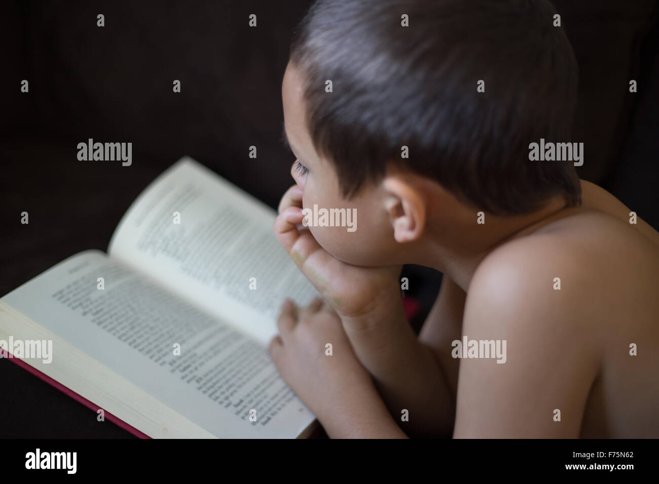 Elementary homeschool boy learning how to read Stock Photo - Alamy