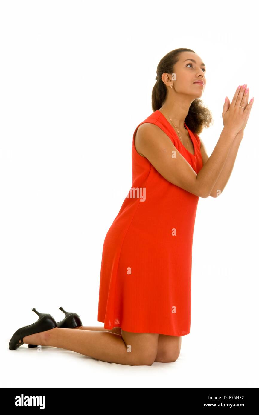 Young woman praying Cut Out Stock Images & Pictures - Alamy