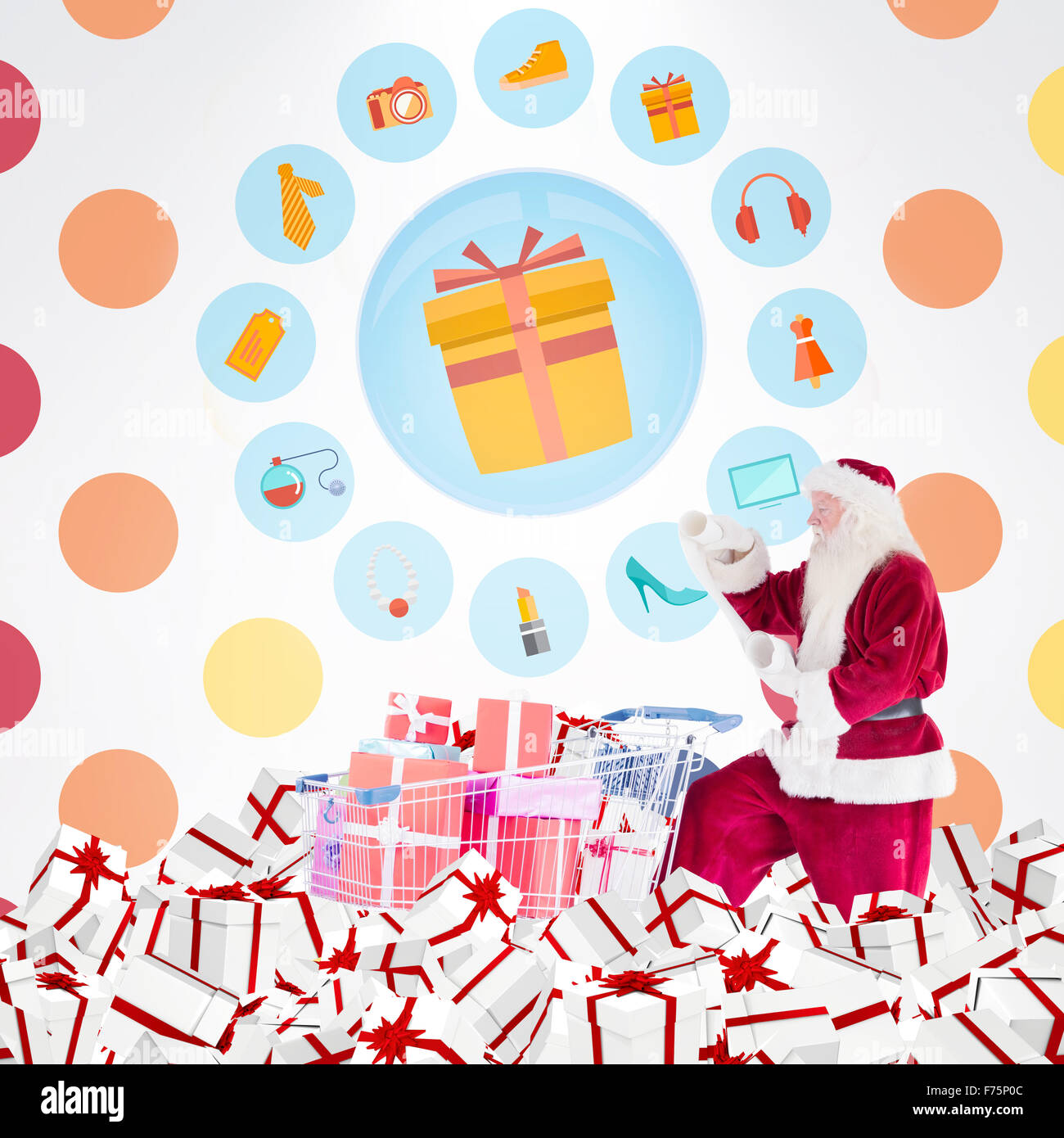 Composite image of santa delivering gifts from cart Stock Photo - Alamy