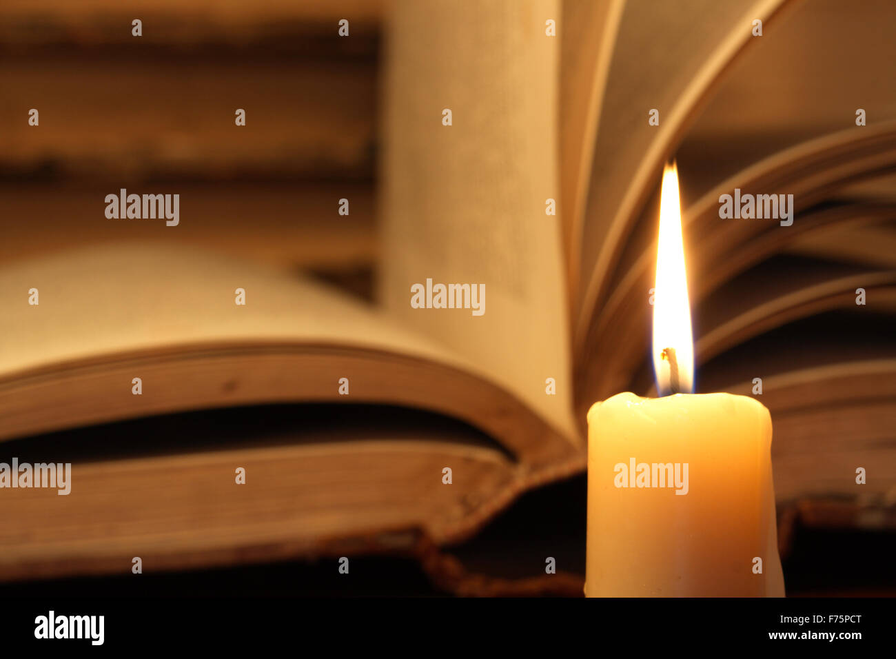 Books And Candle Stock Photo - Alamy