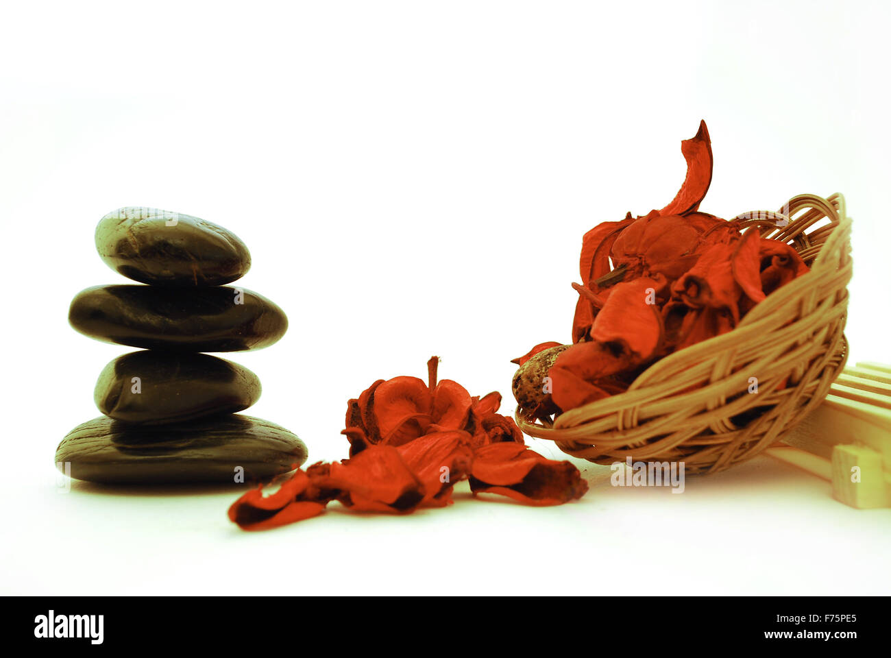 Spa stones and red petals Stock Photo - Alamy