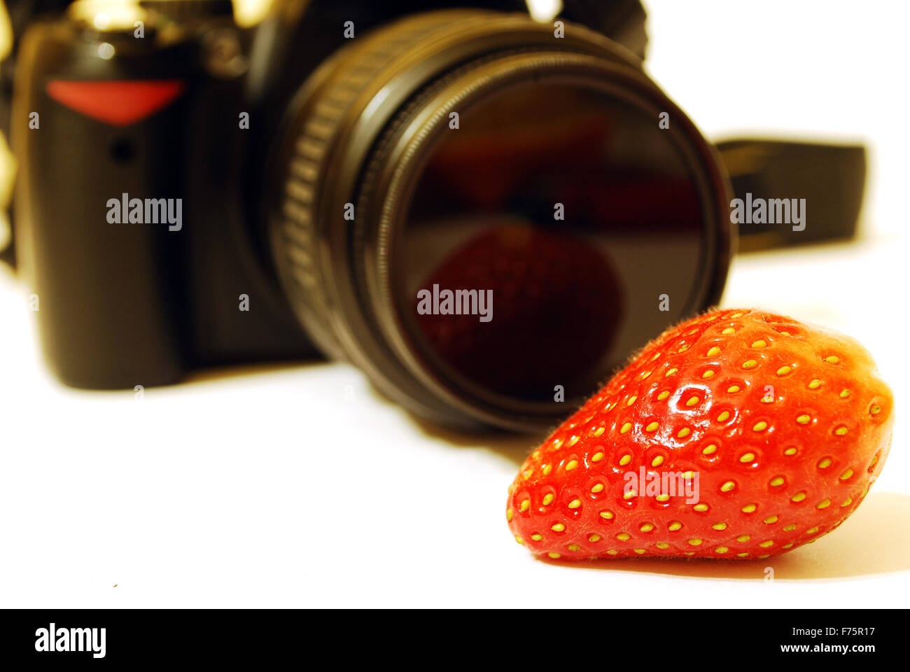 strawberry and a photo camera Stock Photo - Alamy