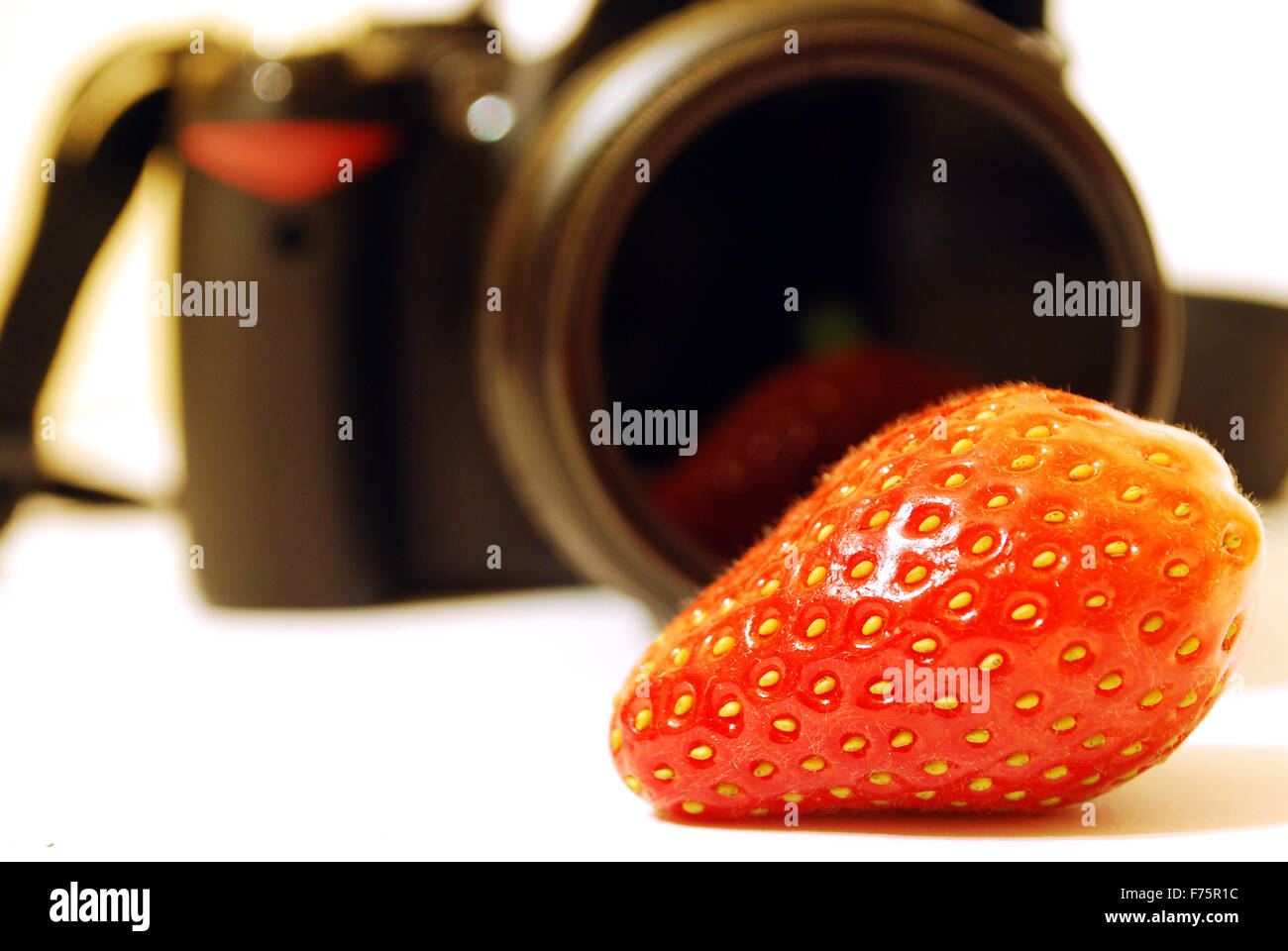 strawberry and a photo camera Stock Photo - Alamy