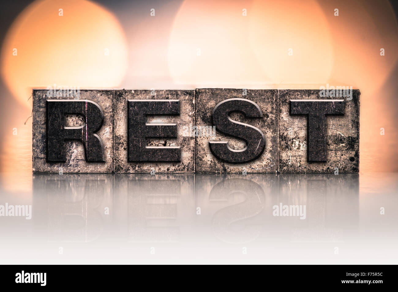 The word "REST" written in vintage ink stained letterpress type Stock ...