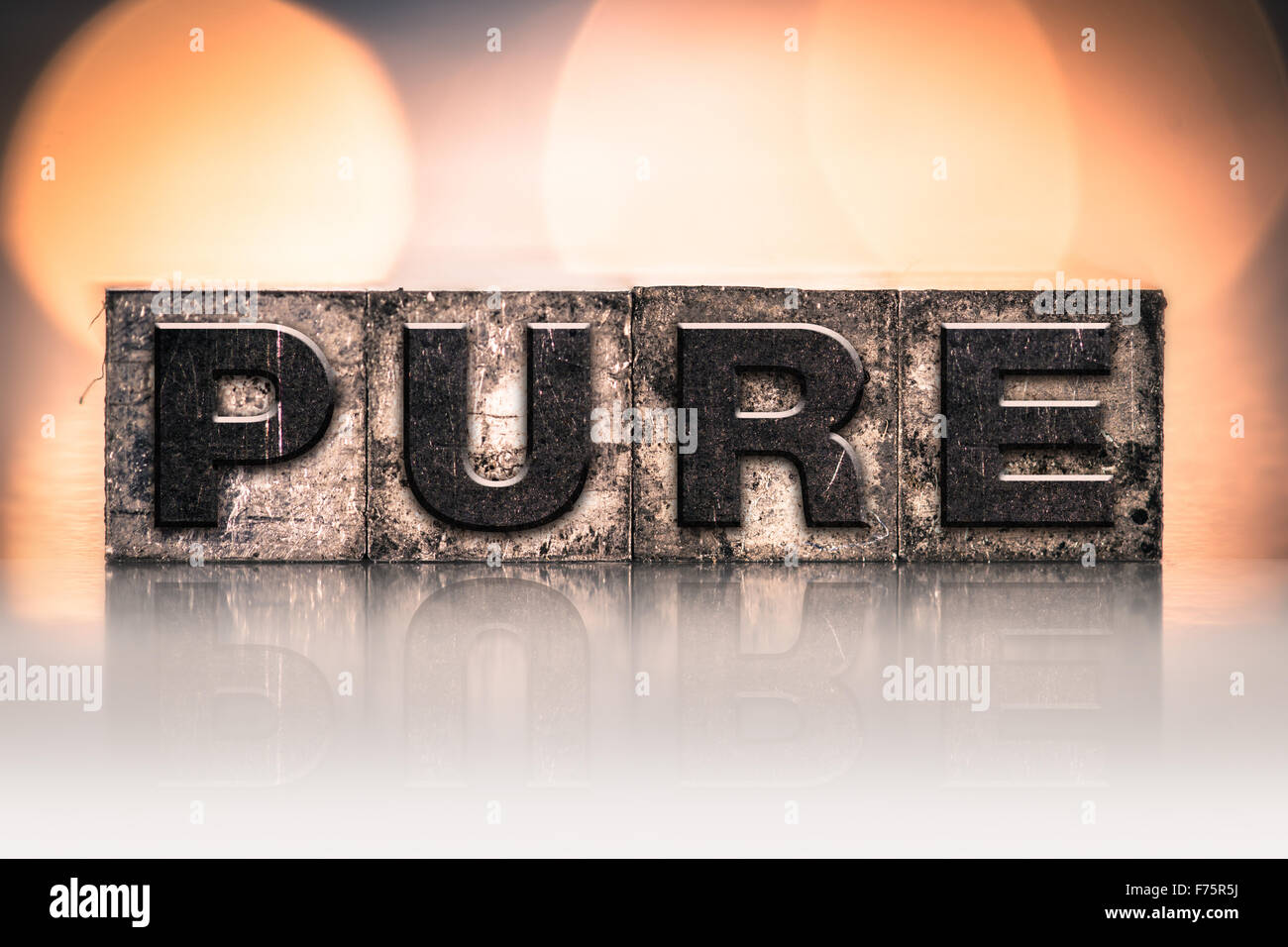 The word "PURE" written in vintage ink stained letterpress type Stock ...