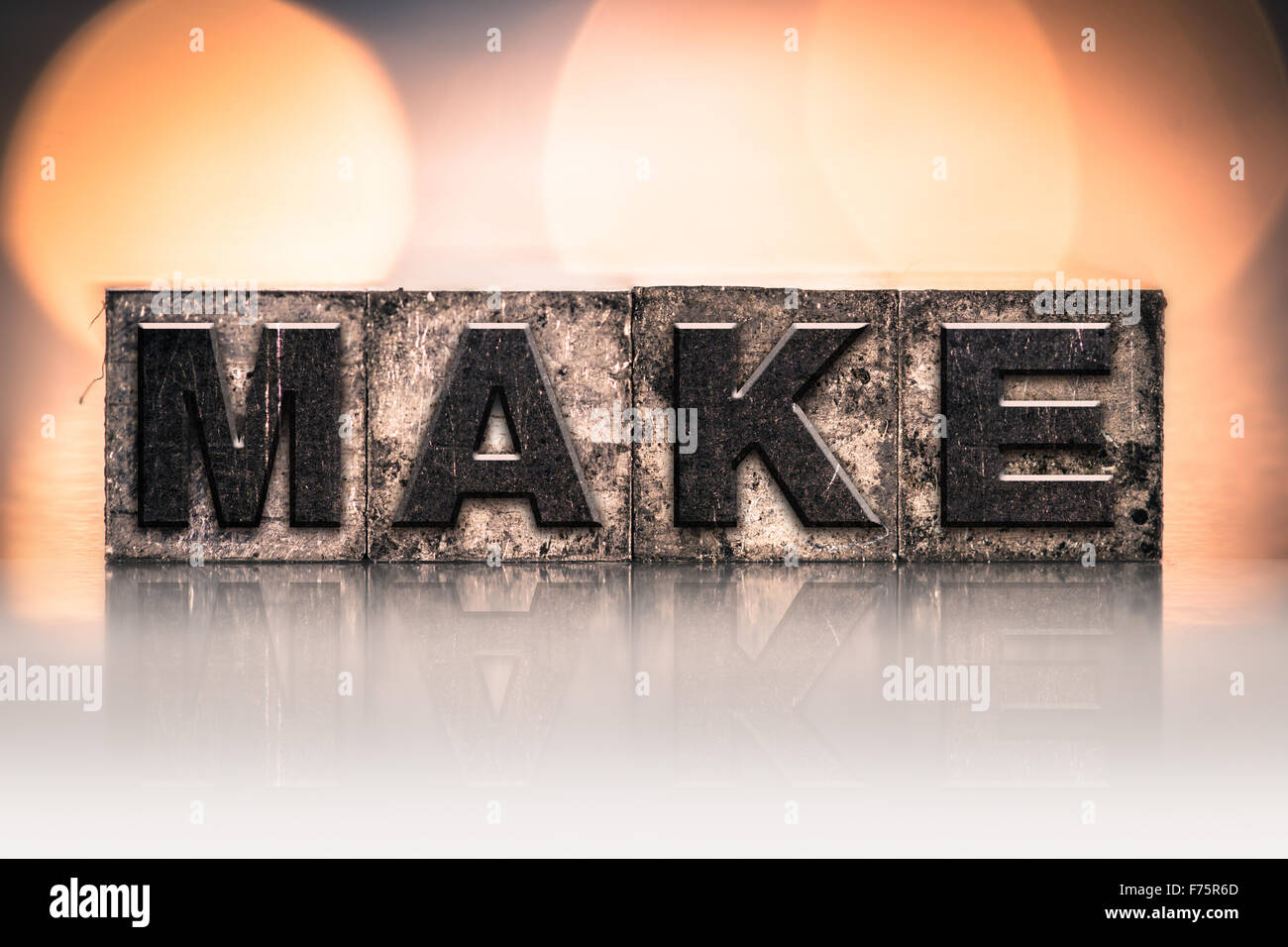 The word "MAKE" written in vintage ink stained letterpress type Stock ...