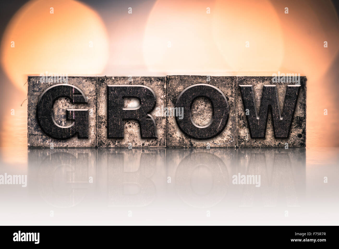 The word "GROW" written in vintage ink stained letterpress type Stock ...