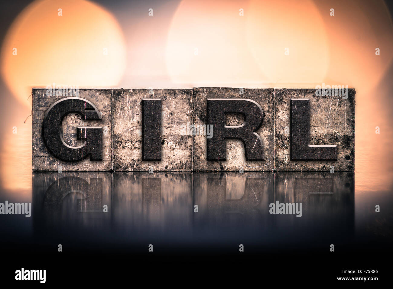 The word "GIRL" written in vintage ink stained letterpress type Stock ...
