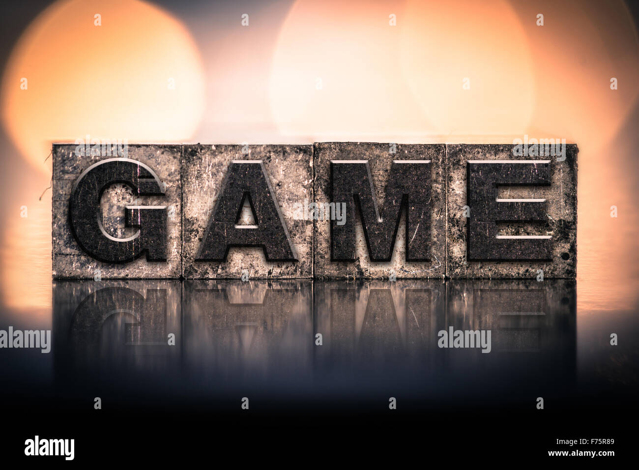 The word "GAME" written in vintage ink stained letterpress type Stock ...