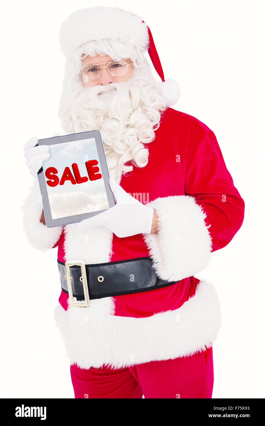 Composite image of happy santa showing digital tablet Stock Photo - Alamy
