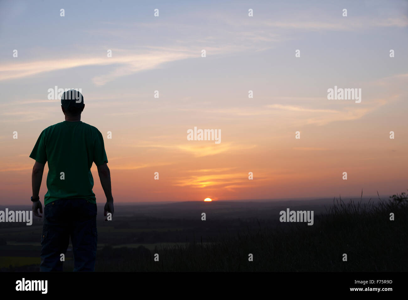 Man and sunset Stock Photo - Alamy
