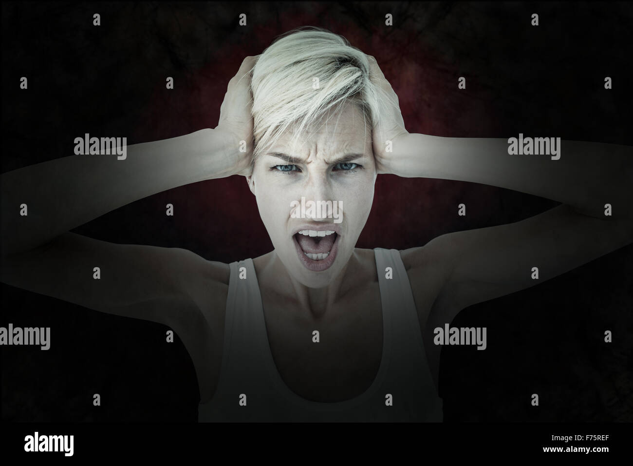 Composite image of angry woman screaming and holding her head Stock ...