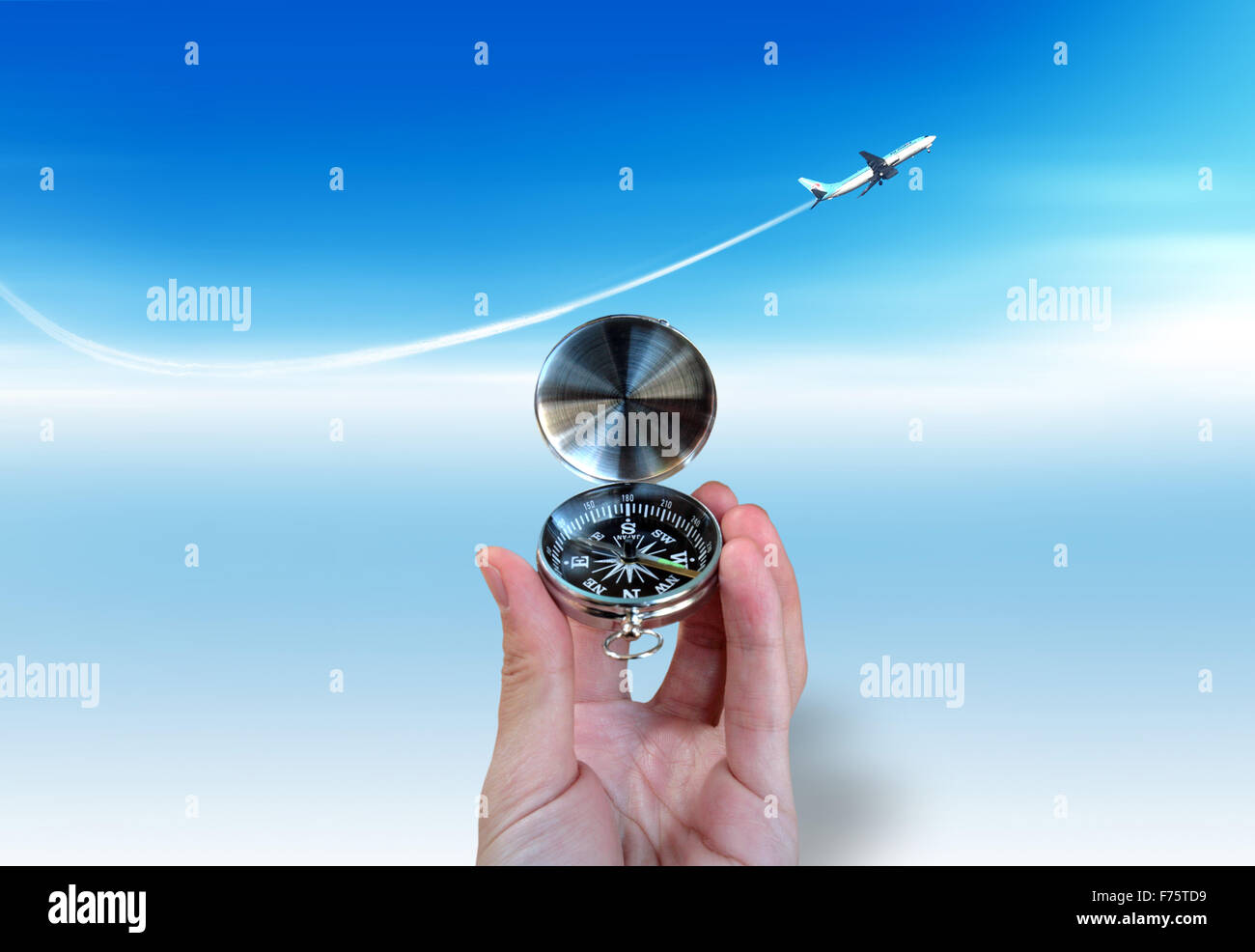 A compass and airplane Stock Photo - Alamy