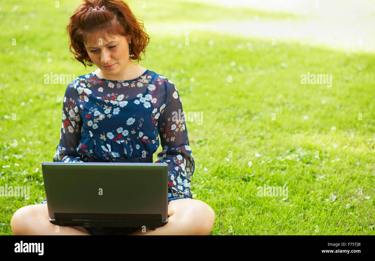 Woman working outdoors Stock Photo - Alamy