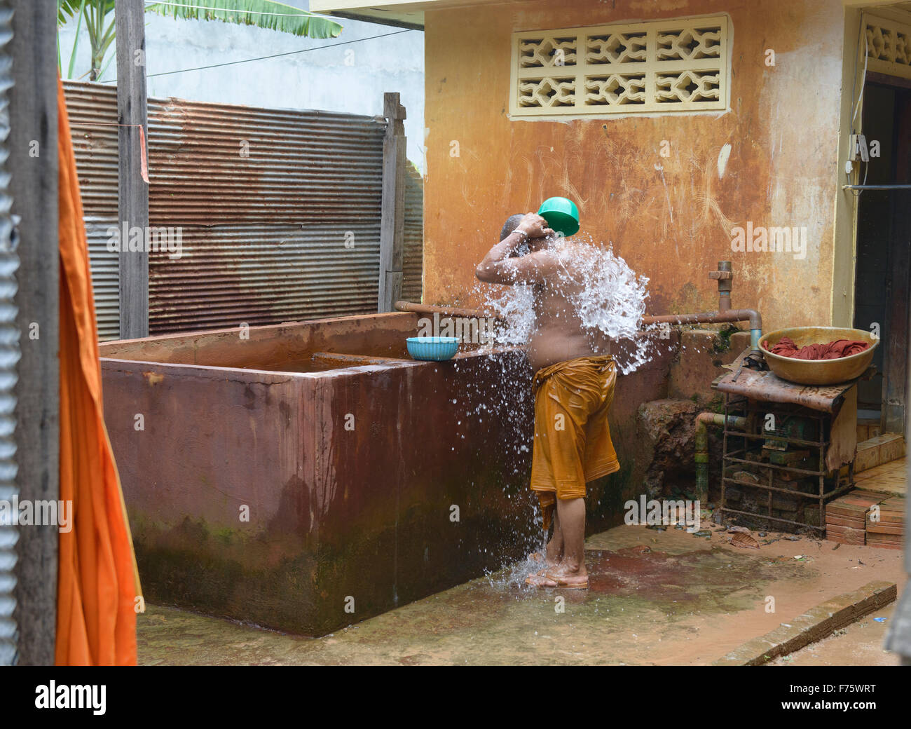 Monk taking a bath, Siem Reap, Cambodia Stock Photo - Alamy