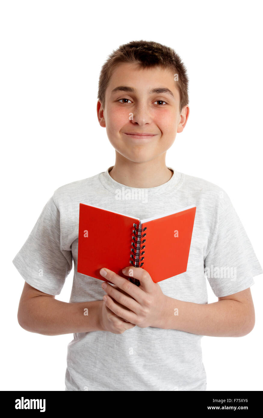 Student holding book in both hands Stock Photo - Alamy