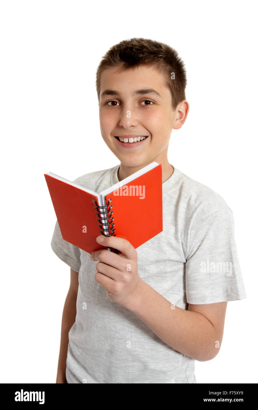 Smiling school student holding small book Stock Photo - Alamy