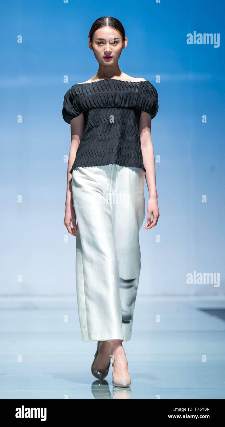 Beijing, China. 25th Nov, 2015. A model presents a creation designed by ...