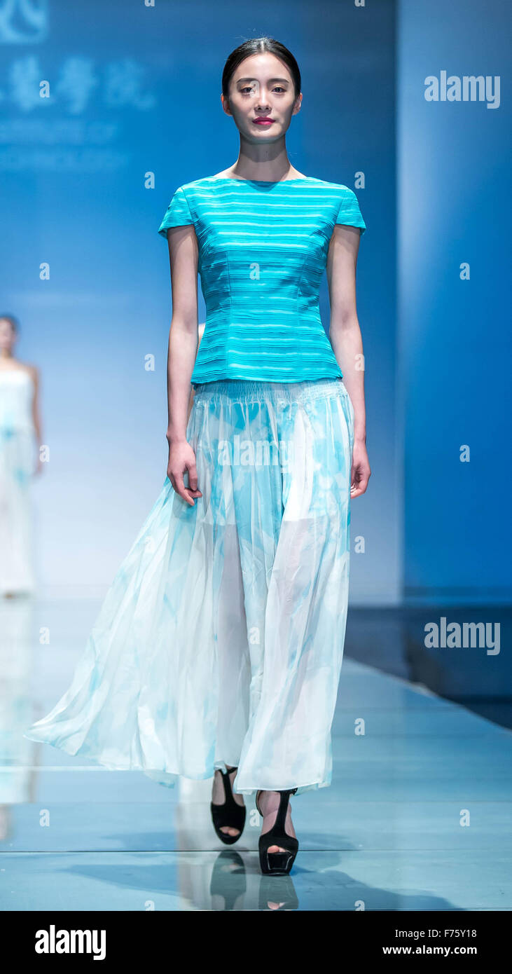 Beijing, China. 25th Nov, 2015. A model presents a creation designed by ...