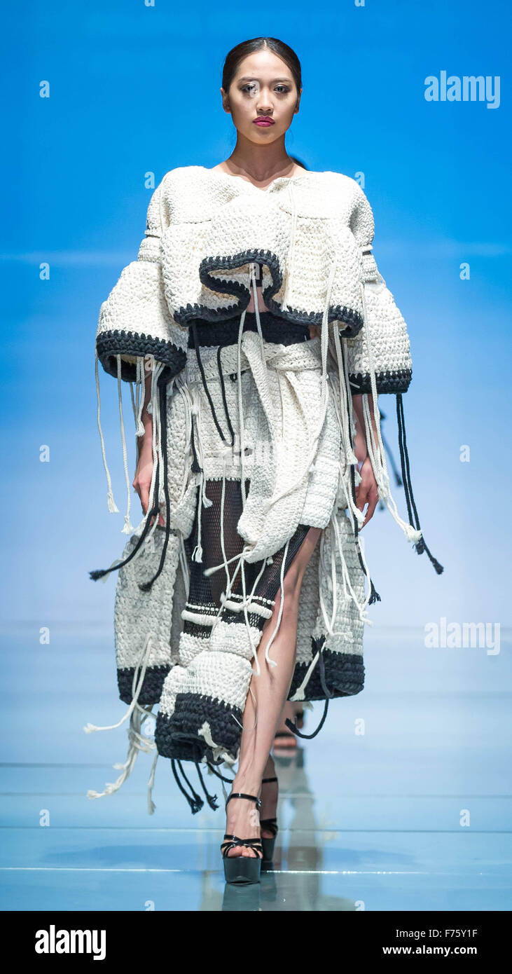 Beijing, China. 25th Nov, 2015. A model presents a creation designed by ...