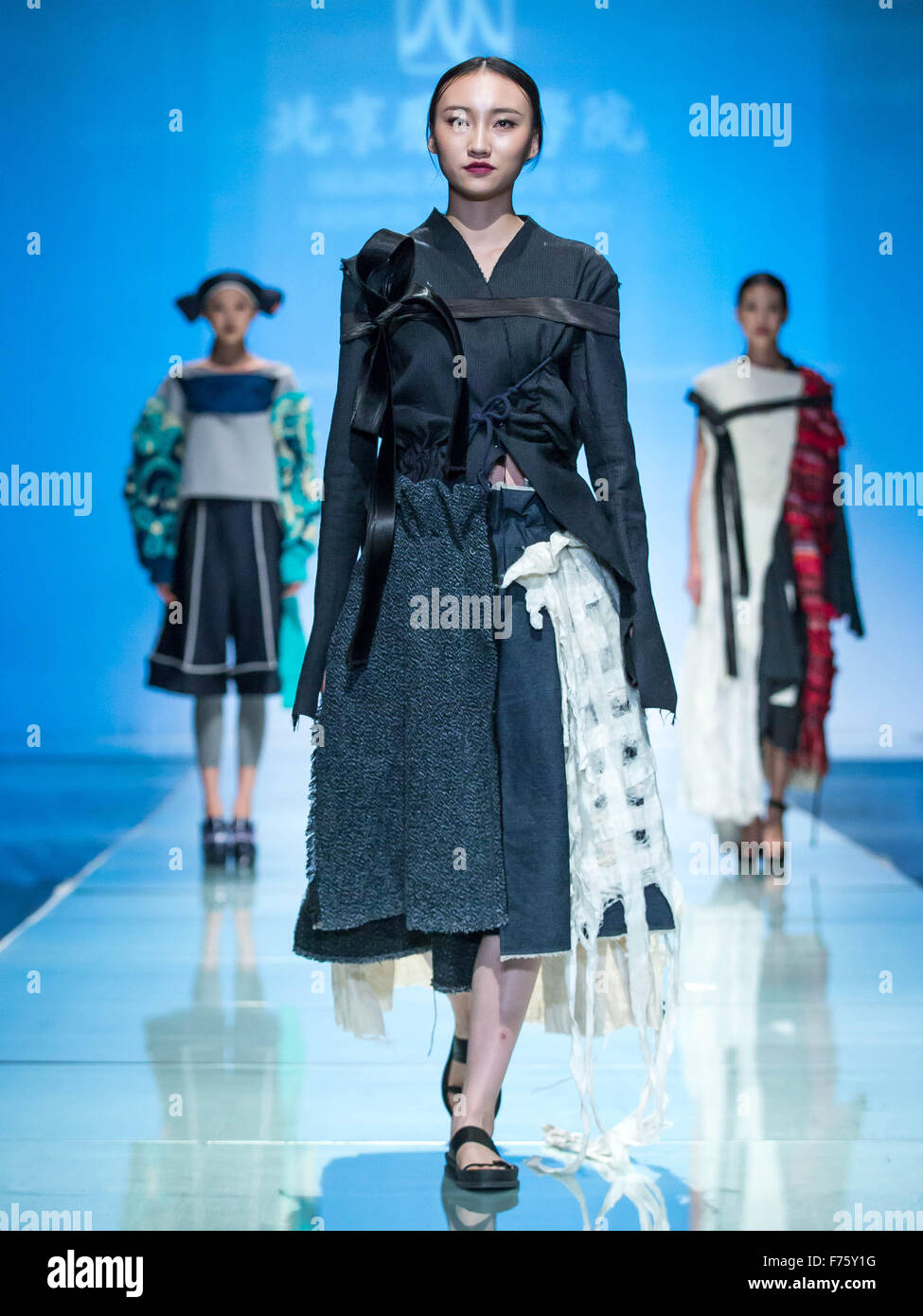 Beijing, China. 25th Nov, 2015. A model presents a creation designed by ...