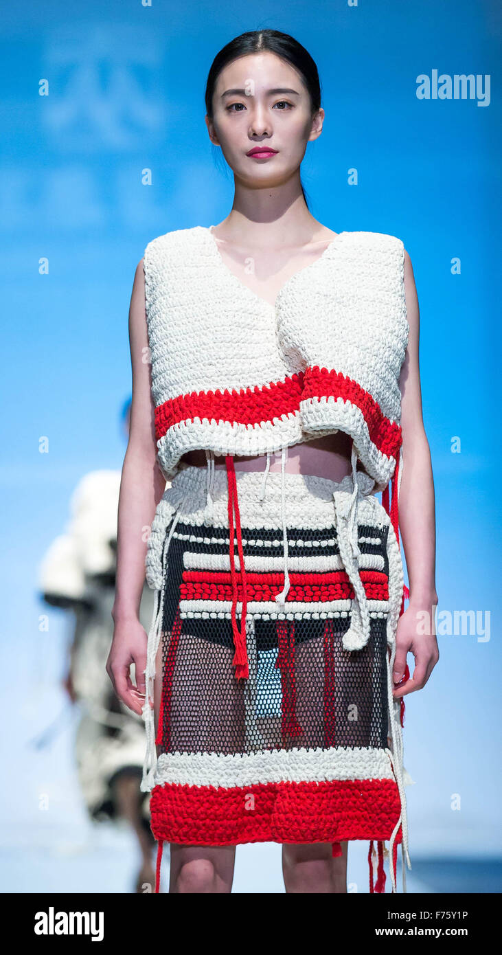 Beijing, China. 25th Nov, 2015. A model presents a creation designed by ...