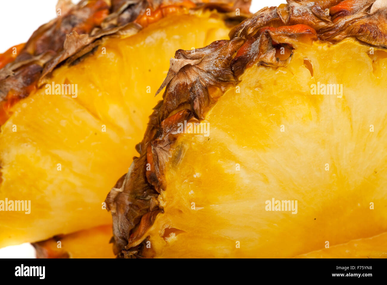 slices of a ripe pineapple isolated on white background Stock Photo - Alamy