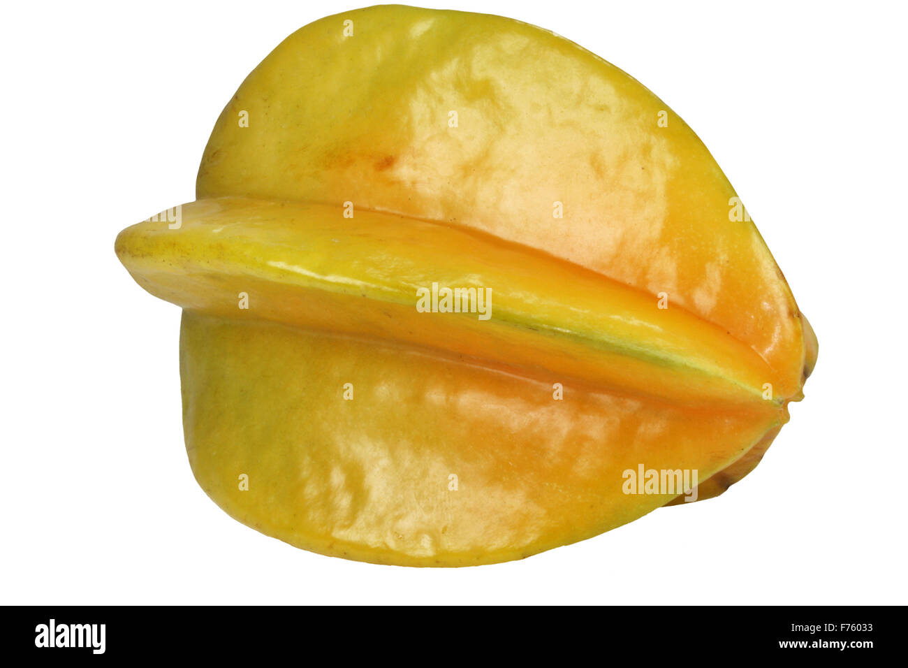 a whole five star fruit on a white background Stock Photo - Alamy