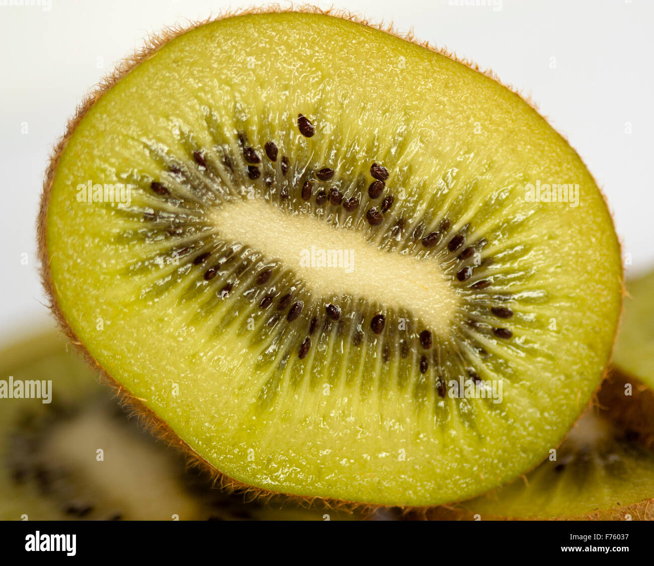 a single fresh kiwi fruit cut open Stock Photo - Alamy