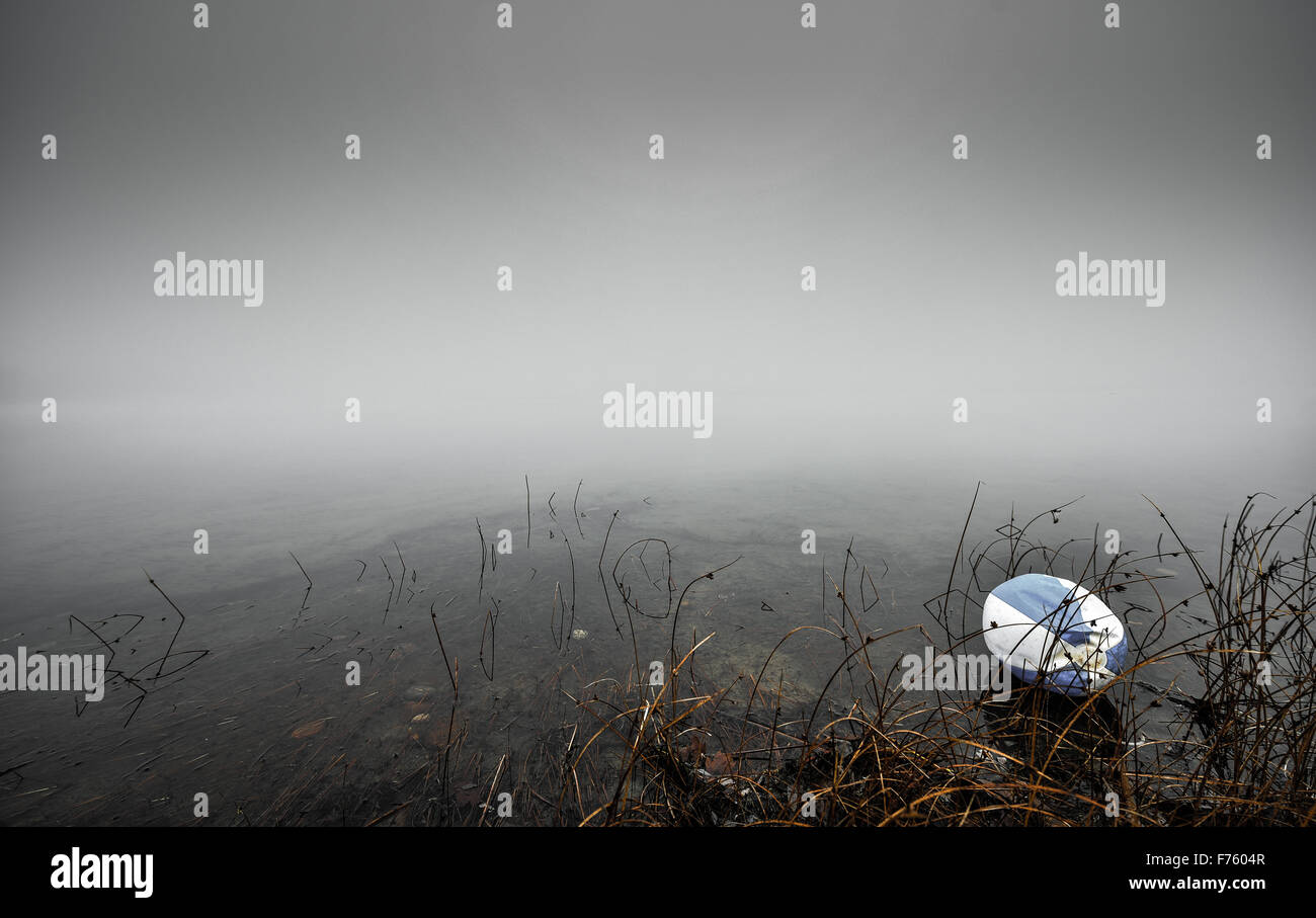 Unloved Beach Ball left behind and abandoned Stock Photo - Alamy