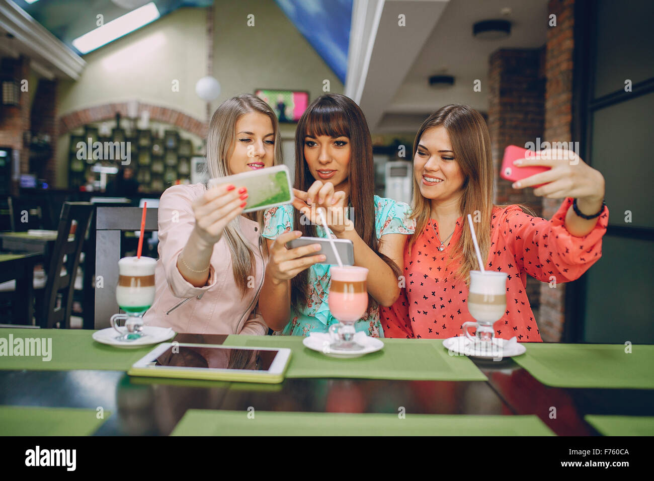 Girls with phones Stock Photo - Alamy