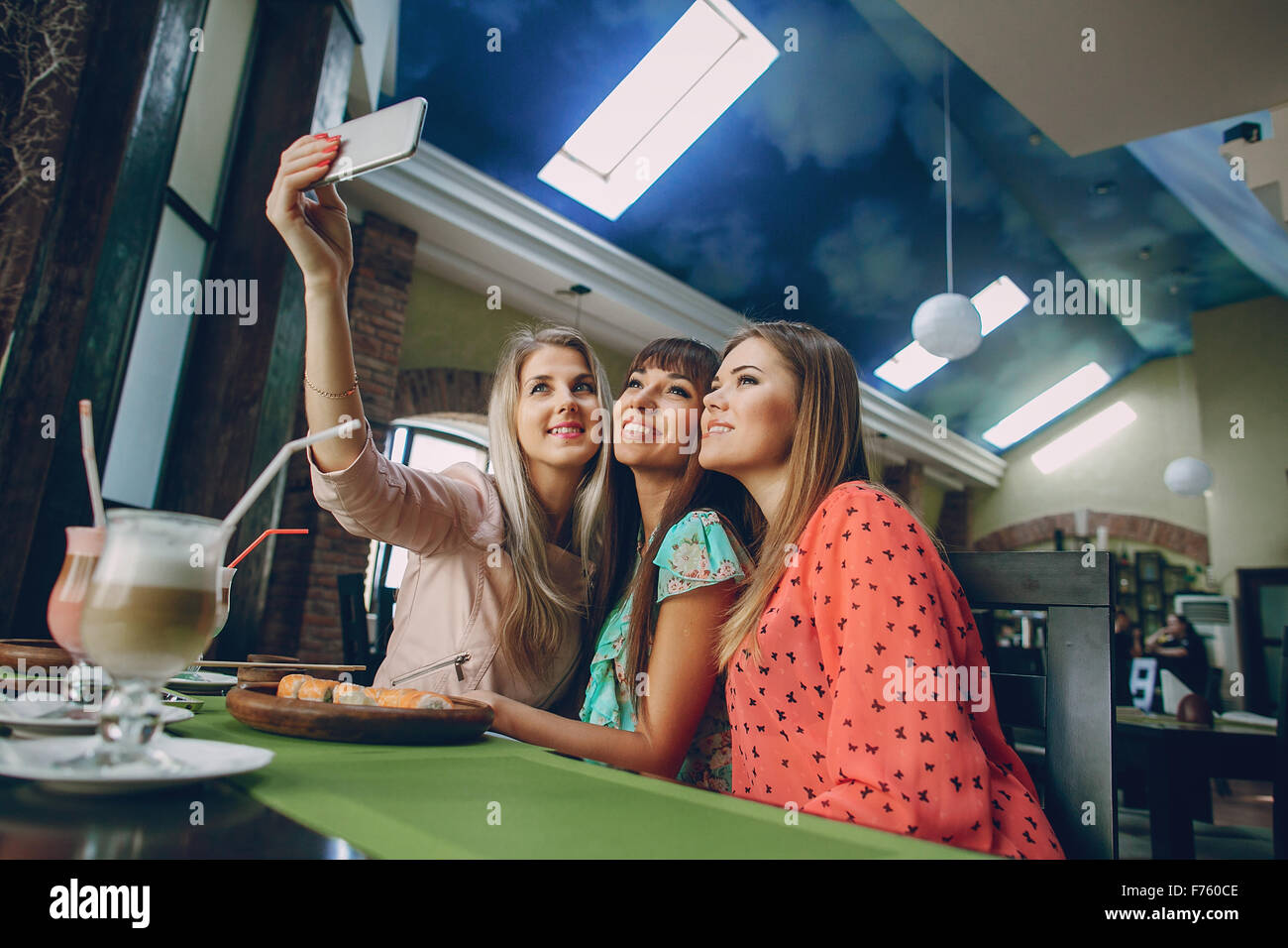 Girls with phones Stock Photo - Alamy