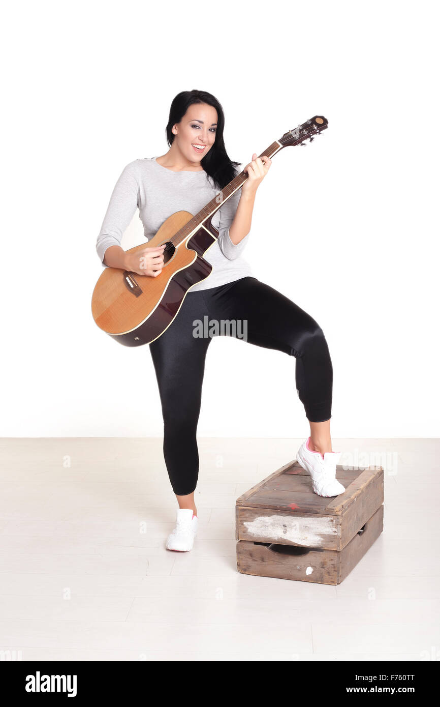 Young female busker playing guitar hi-res stock photography and images ...