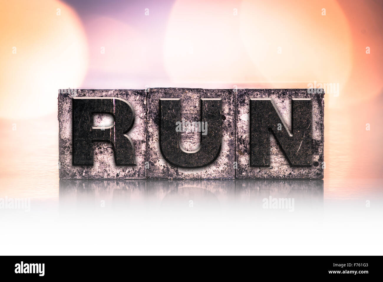The word "RUN" written in vintage ink stained letterpress type Stock ...