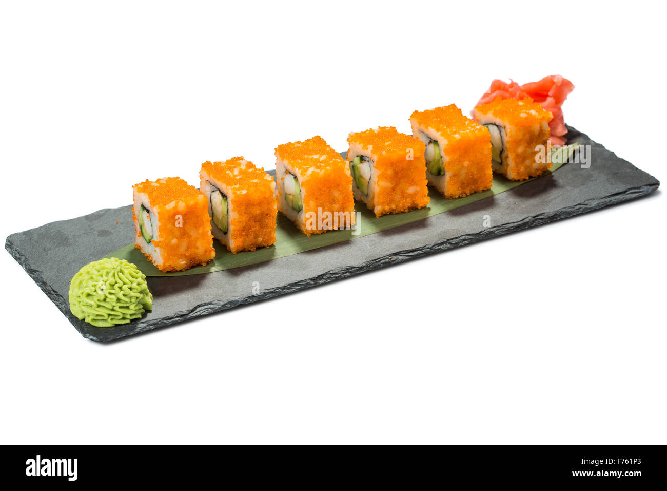 set of sushi on a black substrate, isolated on white background Stock ...