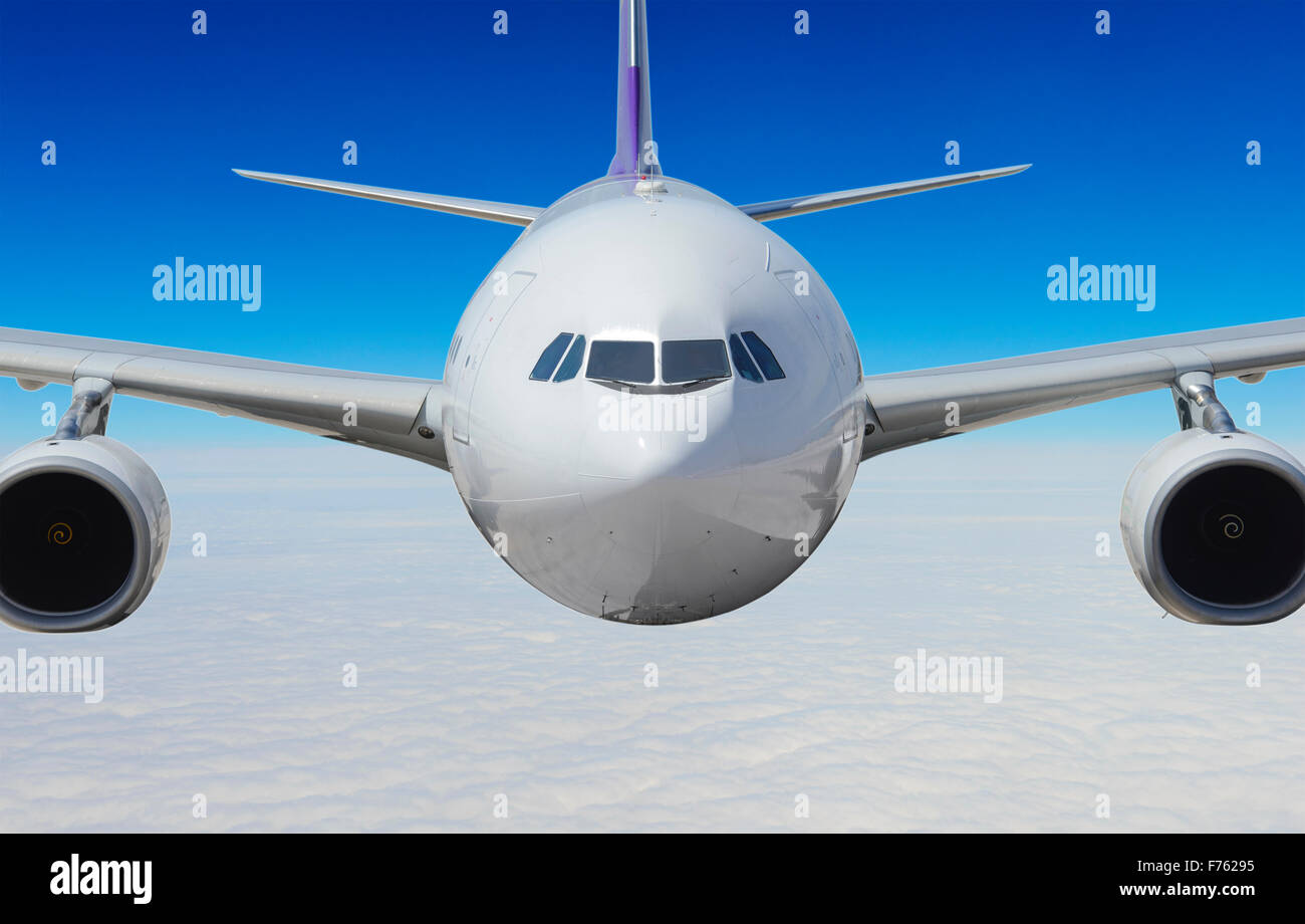 Airplane above the clouds Stock Photo - Alamy