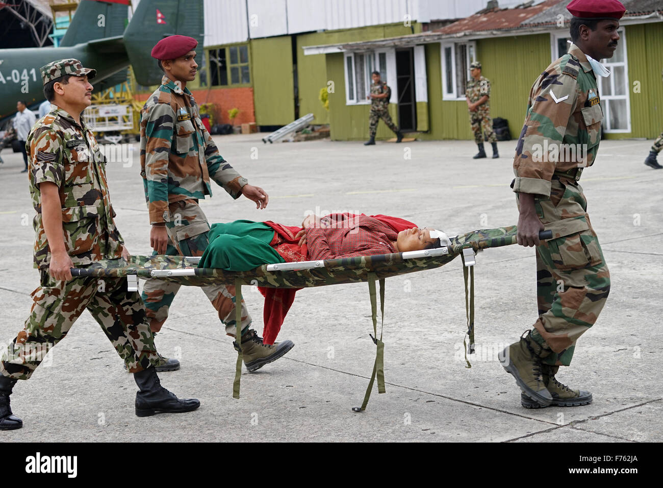 Army personnel carry injured person stretcher, earthquake, nepal, asia ...