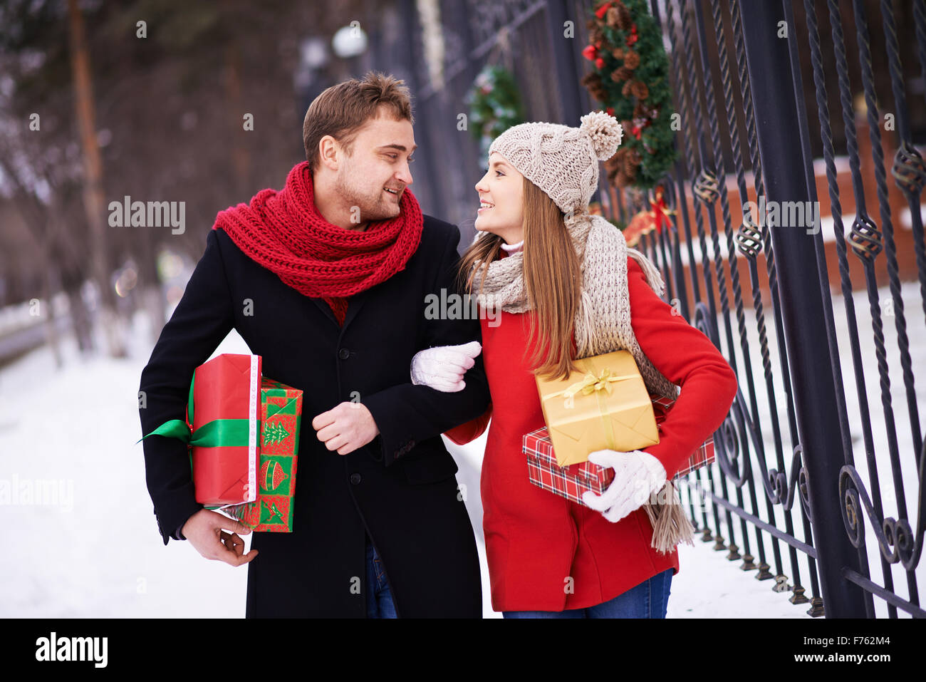Amorous couple going home after buying Christmas presents Stock Photo ...