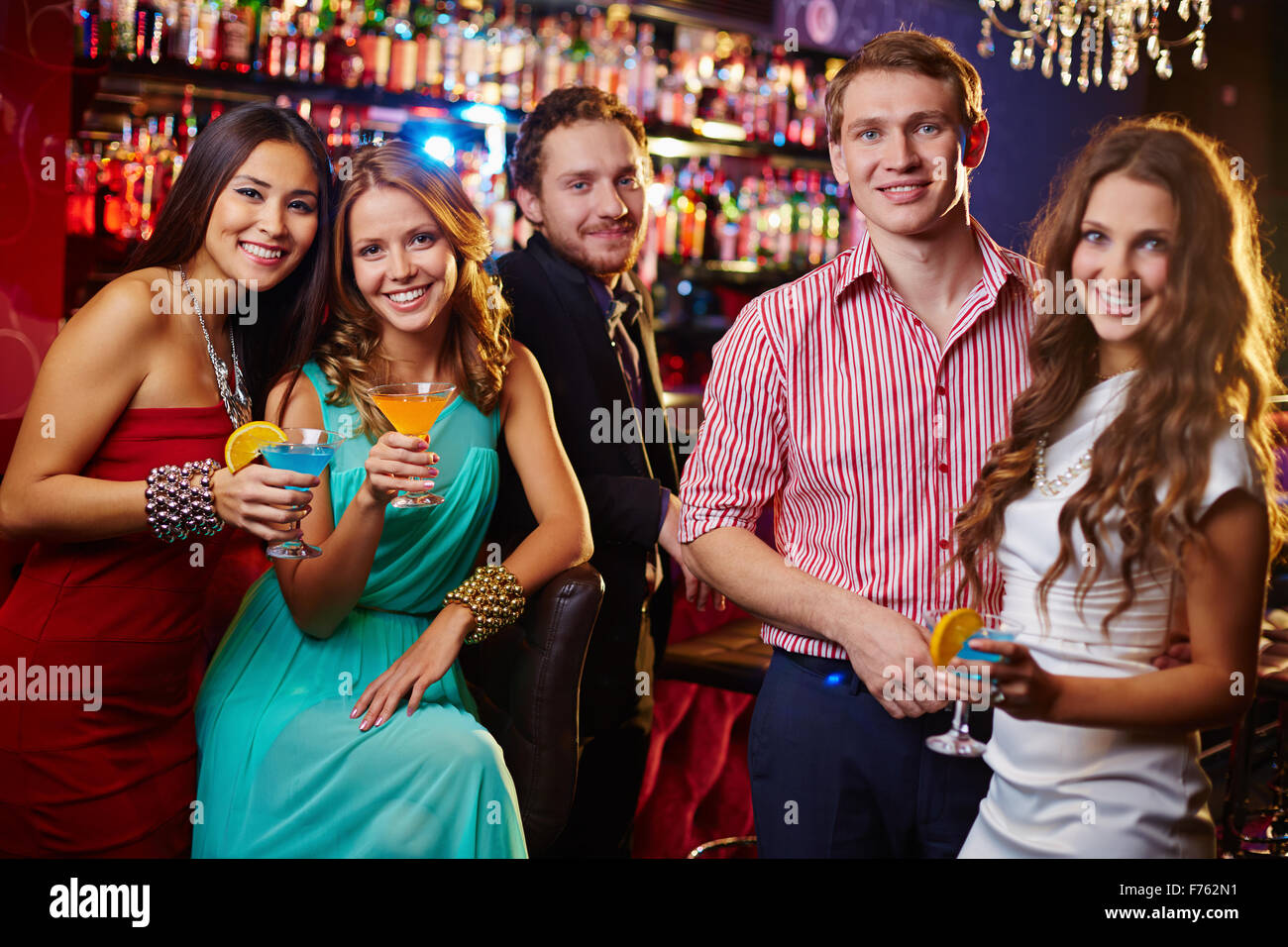 Beautiful people drinking cocktails in nightclub Stock Photo - Alamy