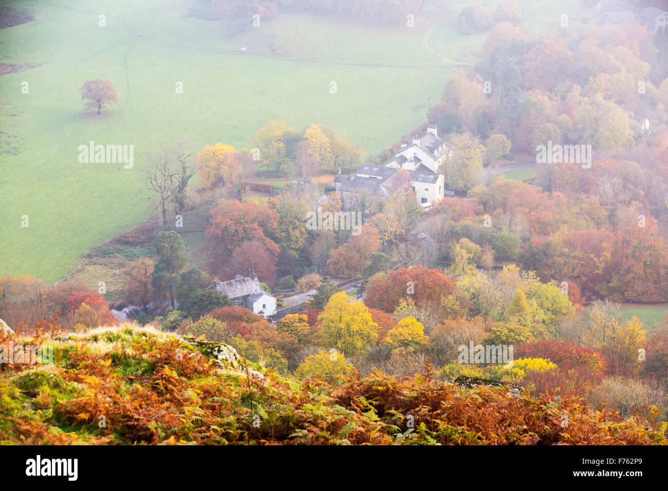 Looking down on houses in Clappersgate near Ambleside in foggy ...