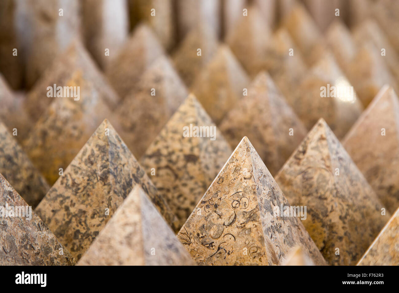 stone pyramids clustered in a pattern to fill the frame creating an ...