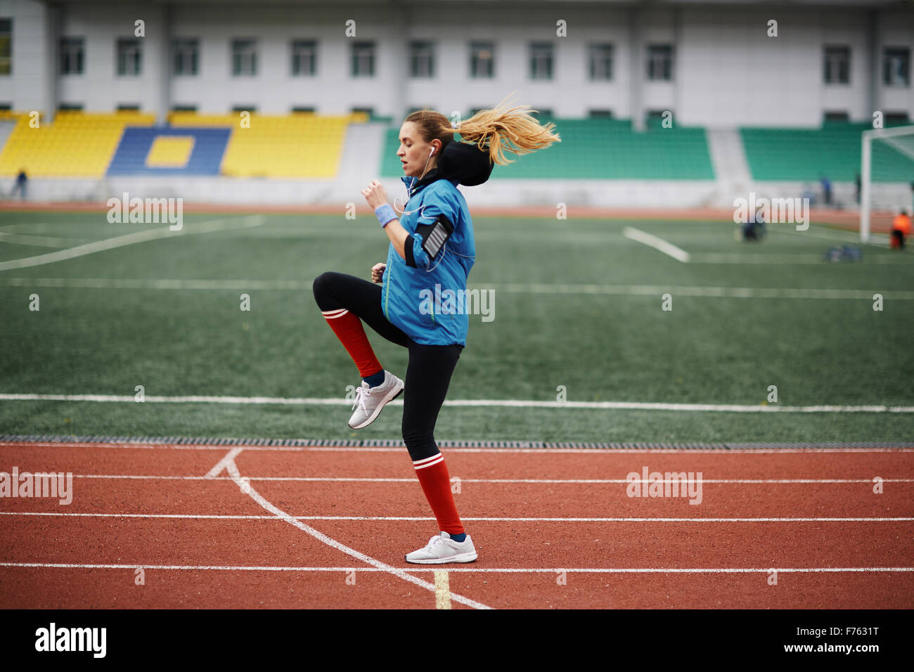 Female athlete training on stadium Stock Photo - Alamy