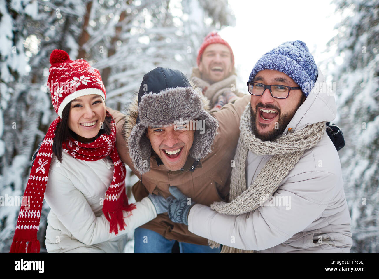 Happy friends having fun in park in winter Stock Photo - Alamy
